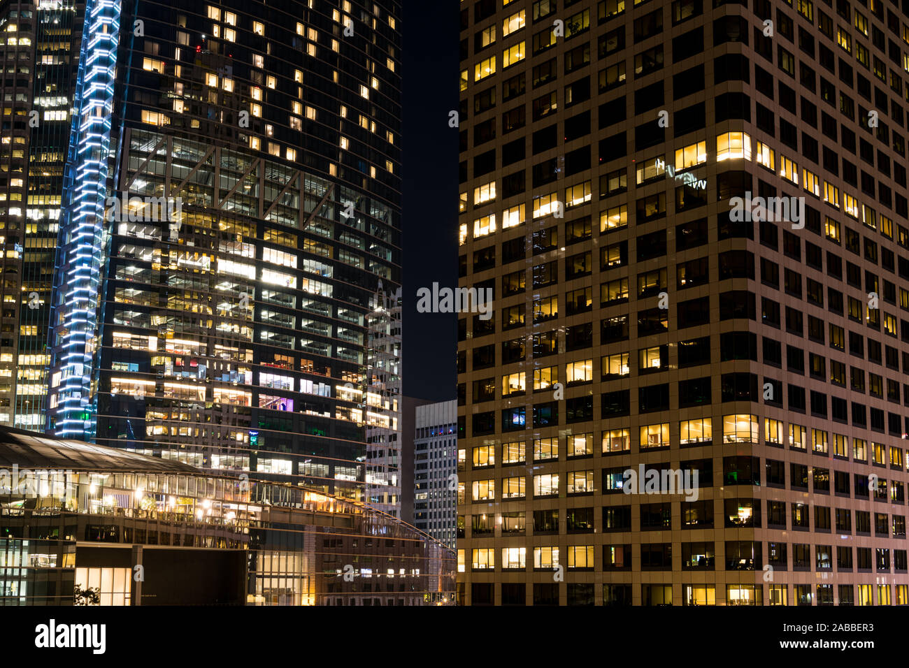 Close up night scene of modern skyscrapers with colorful glowing ...