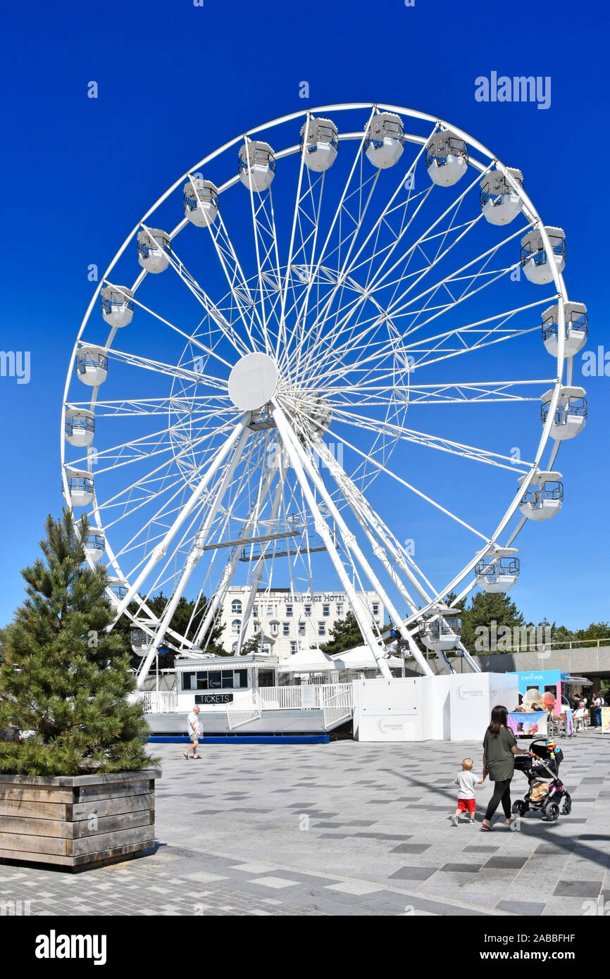 Blue sky summer holiday & seaside resort pedestrian zone & big wheel ...