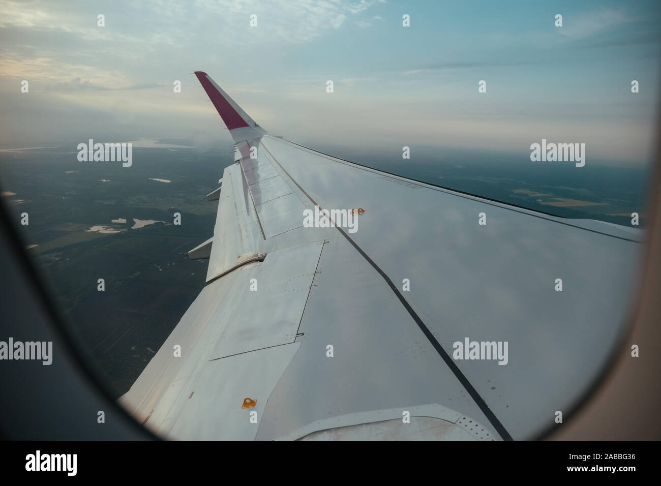 Aiplane windows view on aircraft wing from the cabin, skyline ...