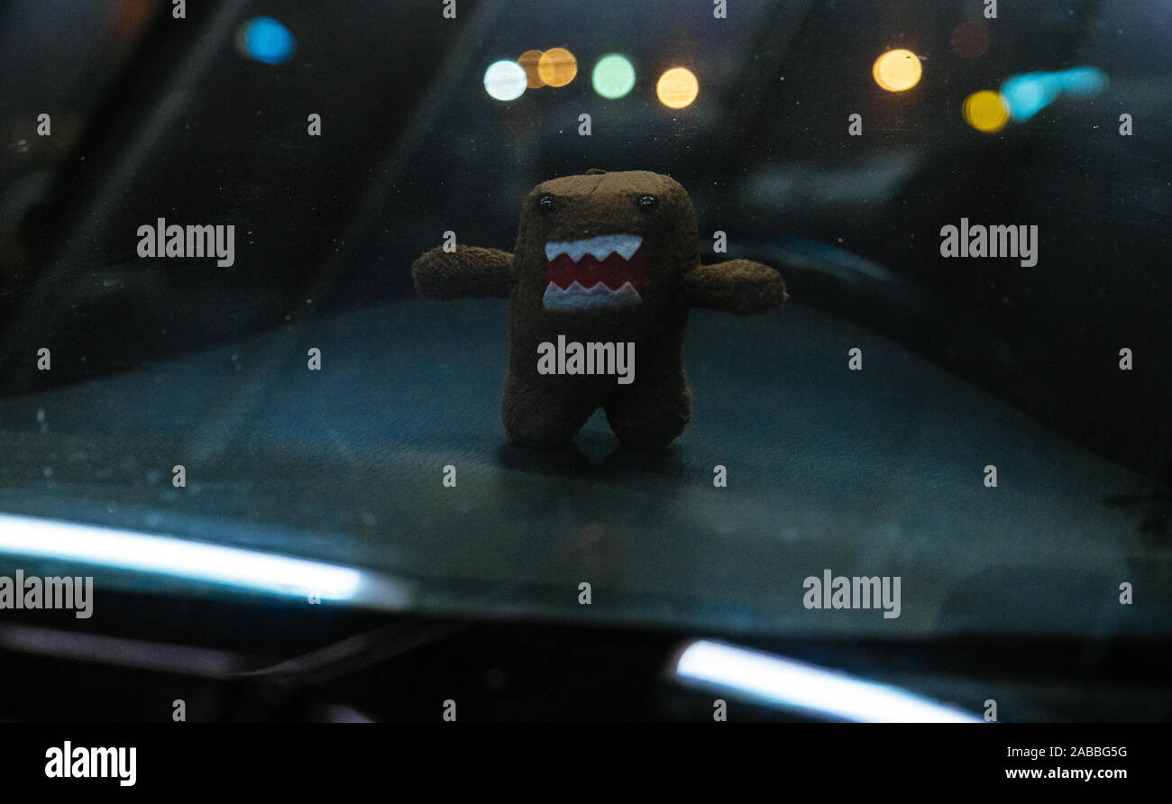 Domo Kun Teddy toy under car front glass Stock Photo - Alamy
