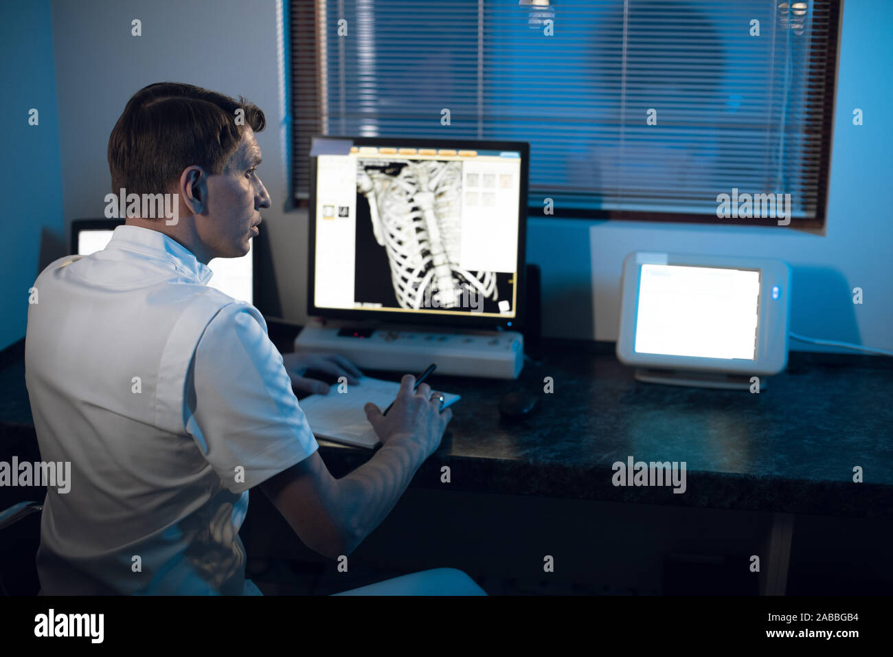 in the Medical Laboratory the Radiologist in the Control room Monitors ...