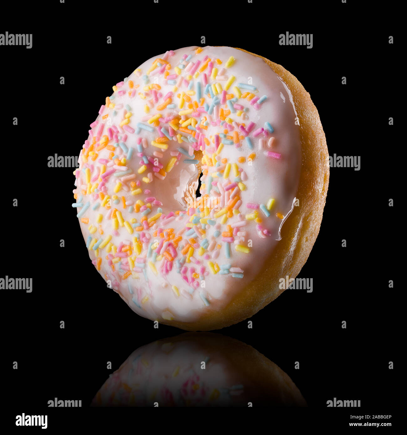 Glazed donut with reflection and clipping path on a black background ...