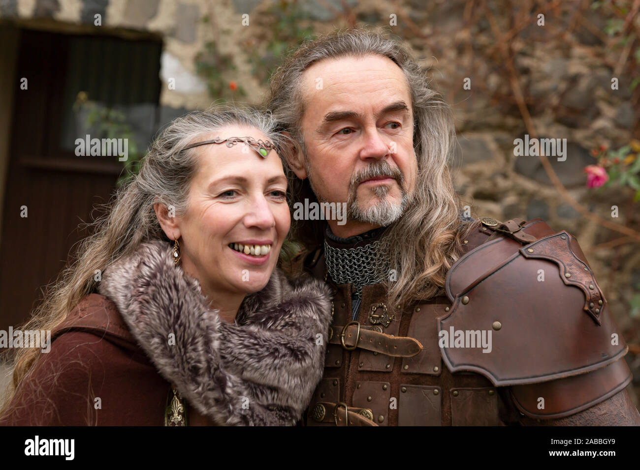 Couple posing robed in beautiful medieval clothing Stock Photo - Alamy