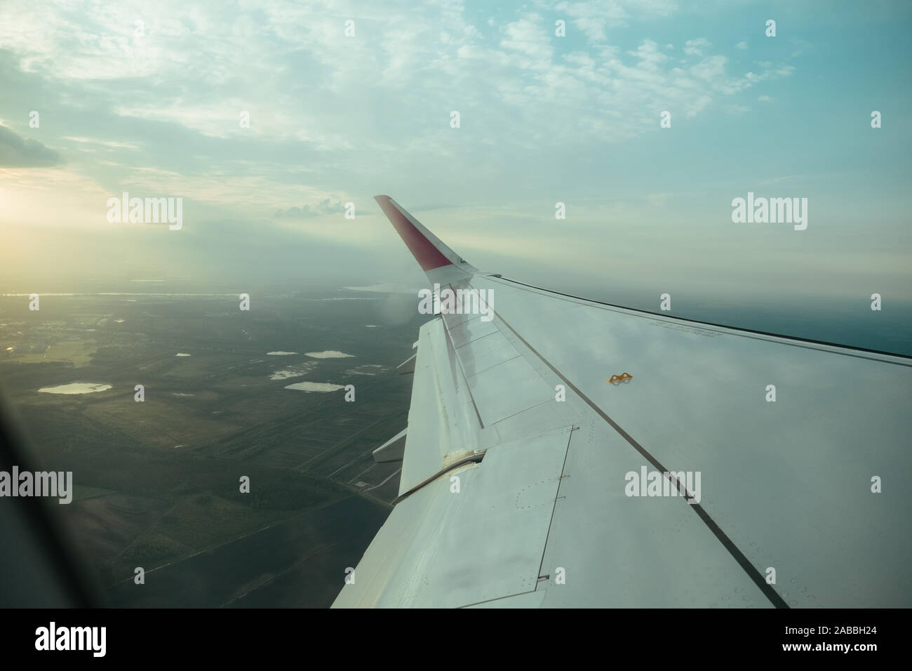 Aiplane windows view on aircraft wing from the cabin, skyline ...