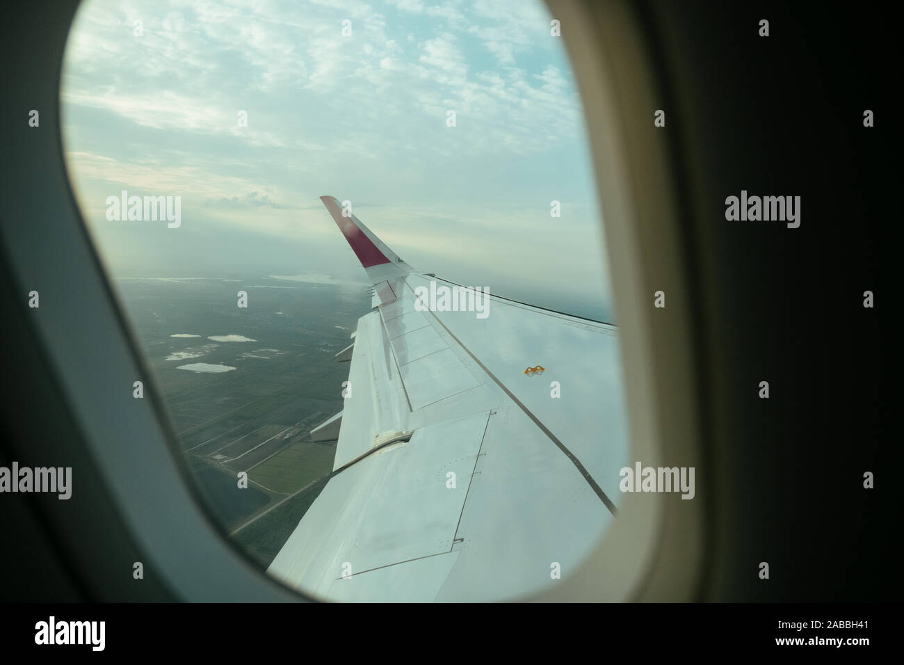 Aiplane windows view on aircraft wing from the cabin, skyline ...