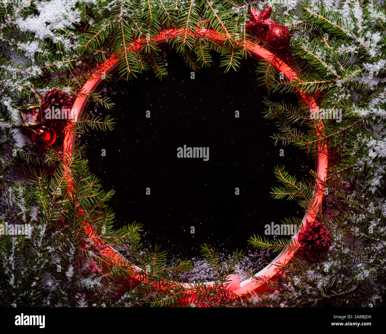 Christmas round frame made by neon and winter things on black ...