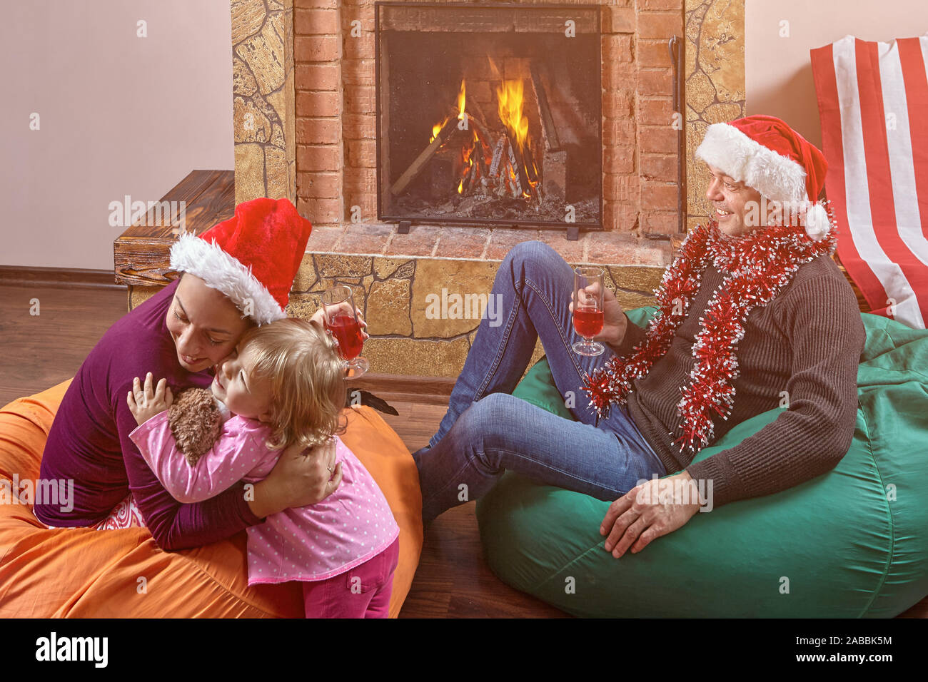 Family sitting in front of fire hearth hi-res stock photography and ...