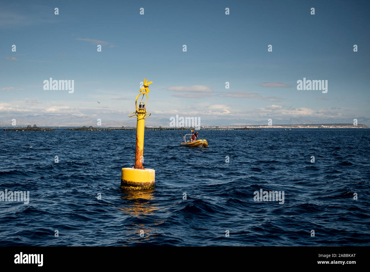Buoying buoy in the sea with fishermen Spain Stock Photo - Alamy