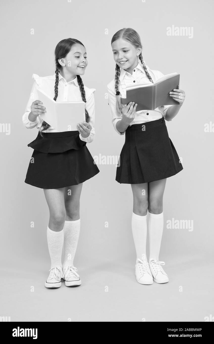 school album. happy girls study with notepad. project work together ...