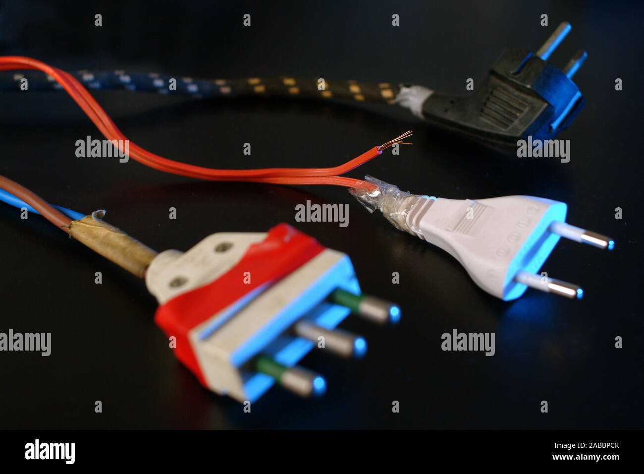 Domestic accidents, dangerous electrical plugs fixed with tape Stock ...