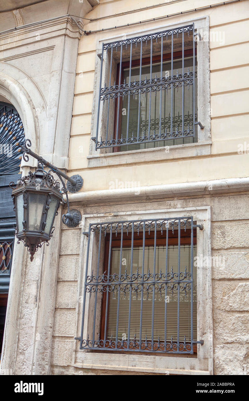 ancient street lamp and windows with grates Stock Photo - Alamy