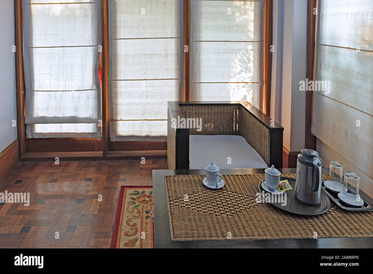 Interior of a hotel room with a tea service in the sitting area ...