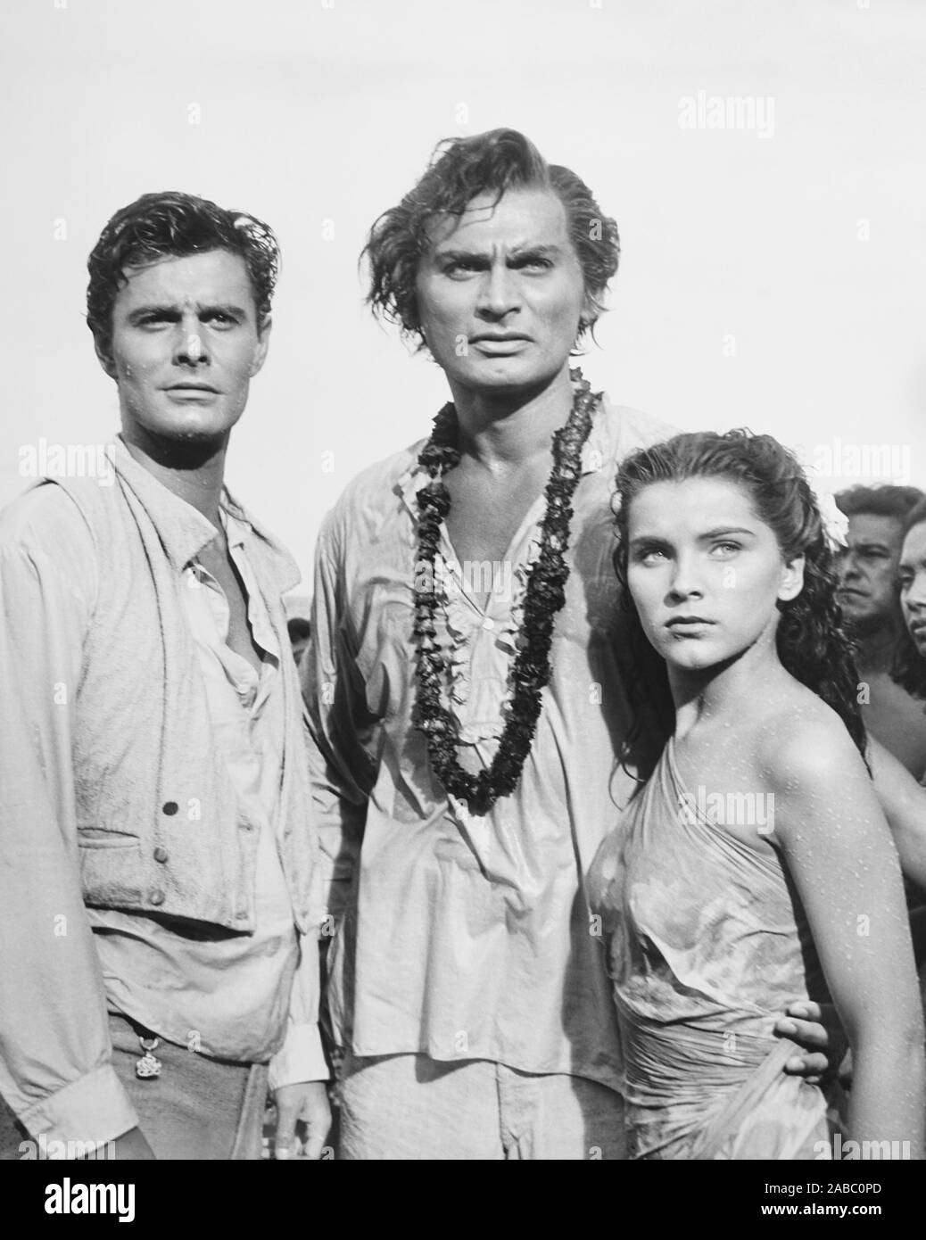 BIRD OF PARADISE, from left: Louis Jourdan, Jeff Chandler, Debra Paget ...