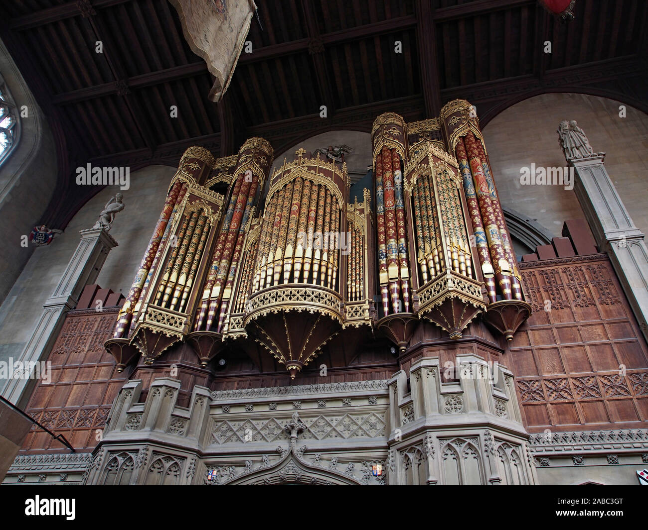 ETON, ENGLAND - AUGUST 2013: Ornate pipe organ in the ancient chapel of ...