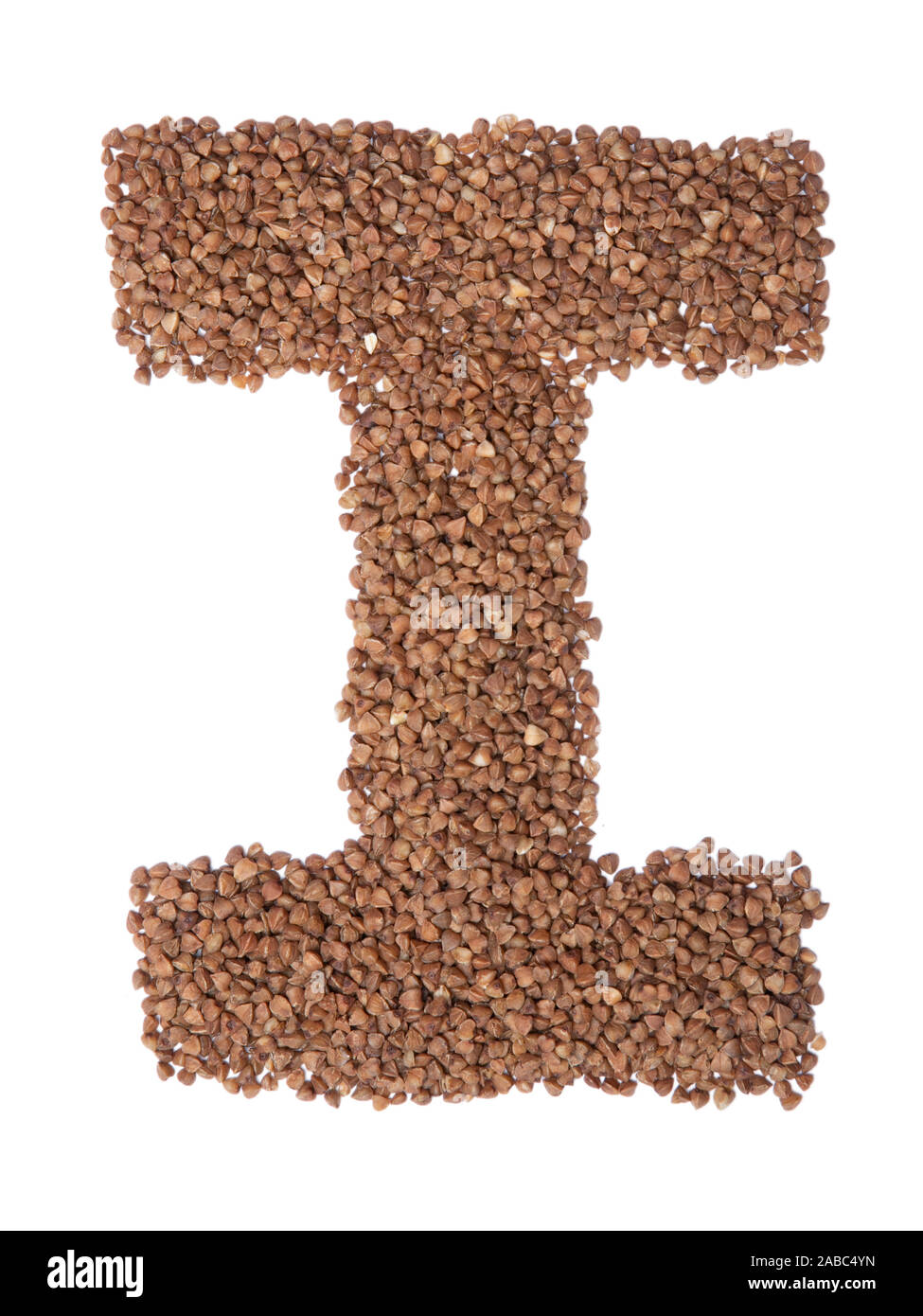 Letter I of the English alphabet from brown dry buckwheat on a white ...