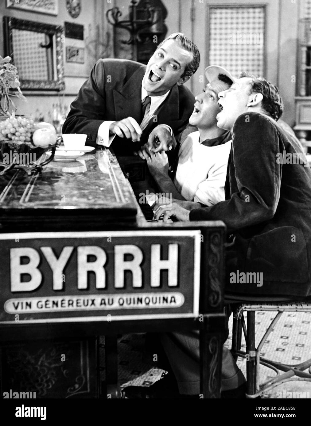 AN AMERICAN IN PARIS, from left, Georges Guetary, Gene Kelly, Oscar ...