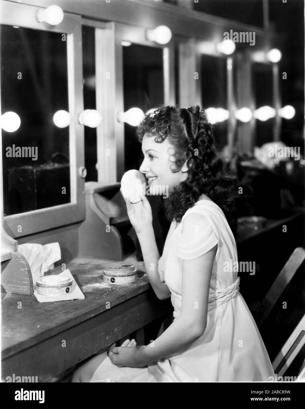 ANTHONY ADVERSE, Olivia de Havilland, touching up her makeup between ...