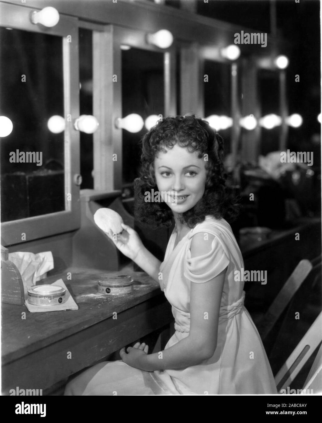 ANTHONY ADVERSE, Olivia de Havilland, touching up her makeup between ...