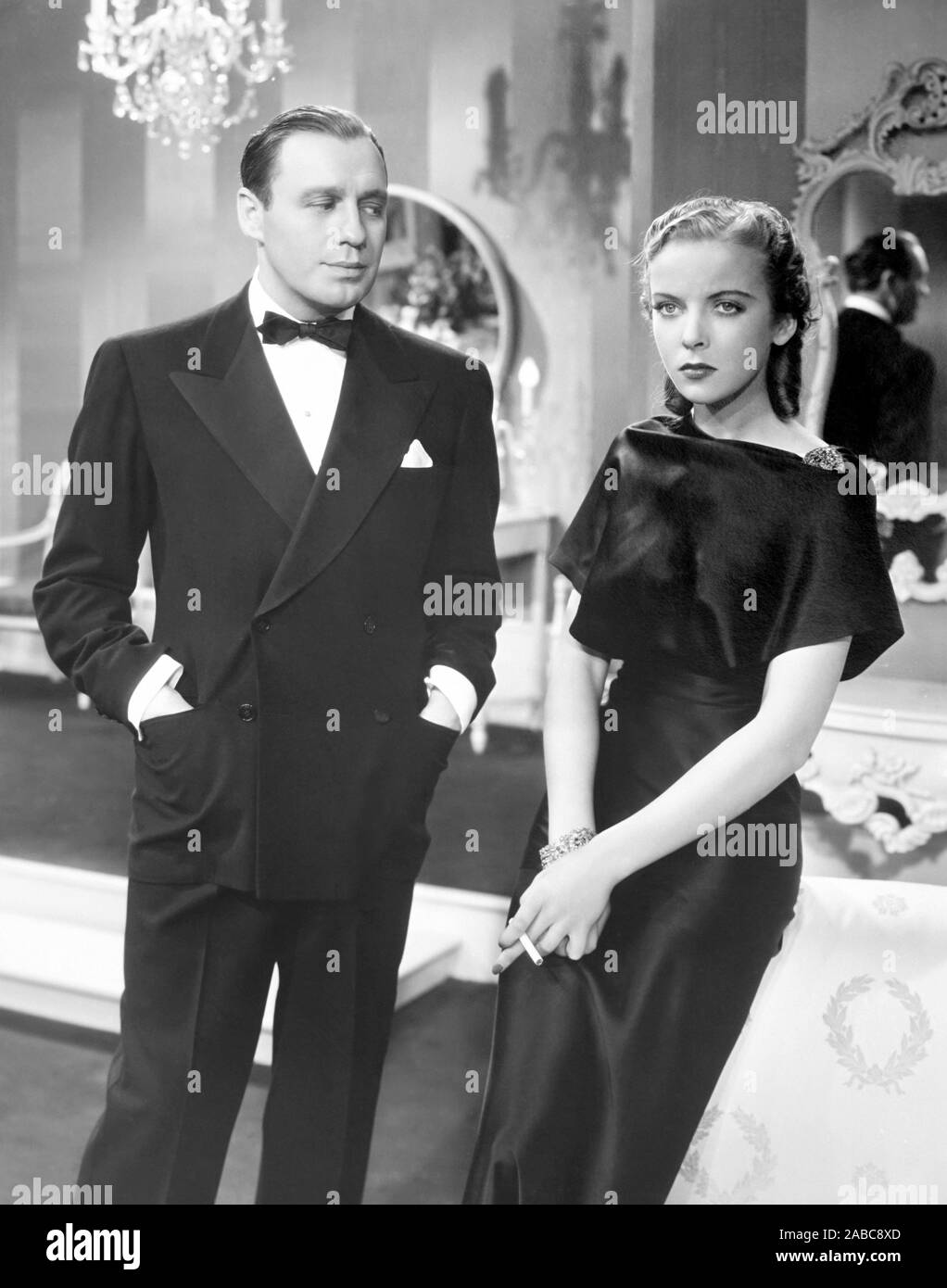 ARTISTS AND MODELS, from left, Jack Benny, Ida Lupino (in a gown by ...