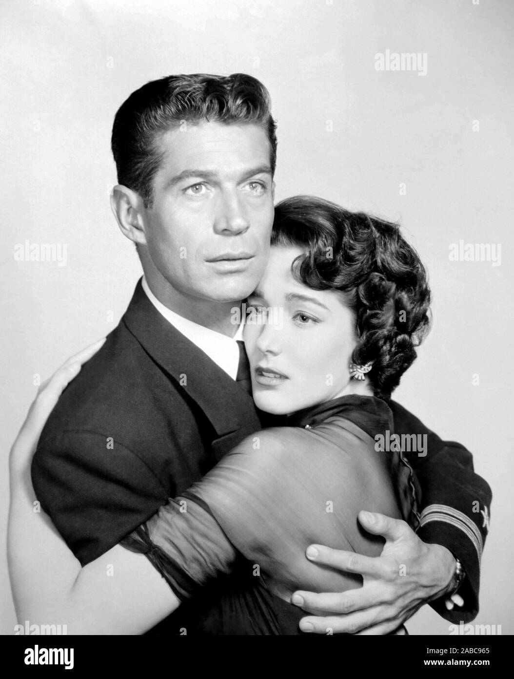 AWAY ALL BOATS, from left, George Nader, Julie Adams, 1956 Stock Photo ...