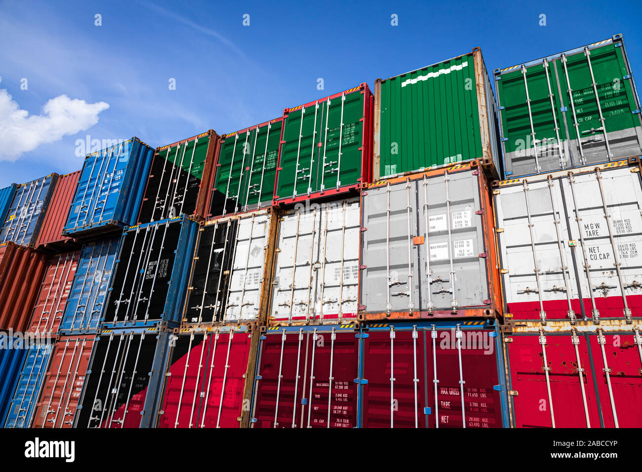 The national flag of Kuwait on a large number of metal containers for ...