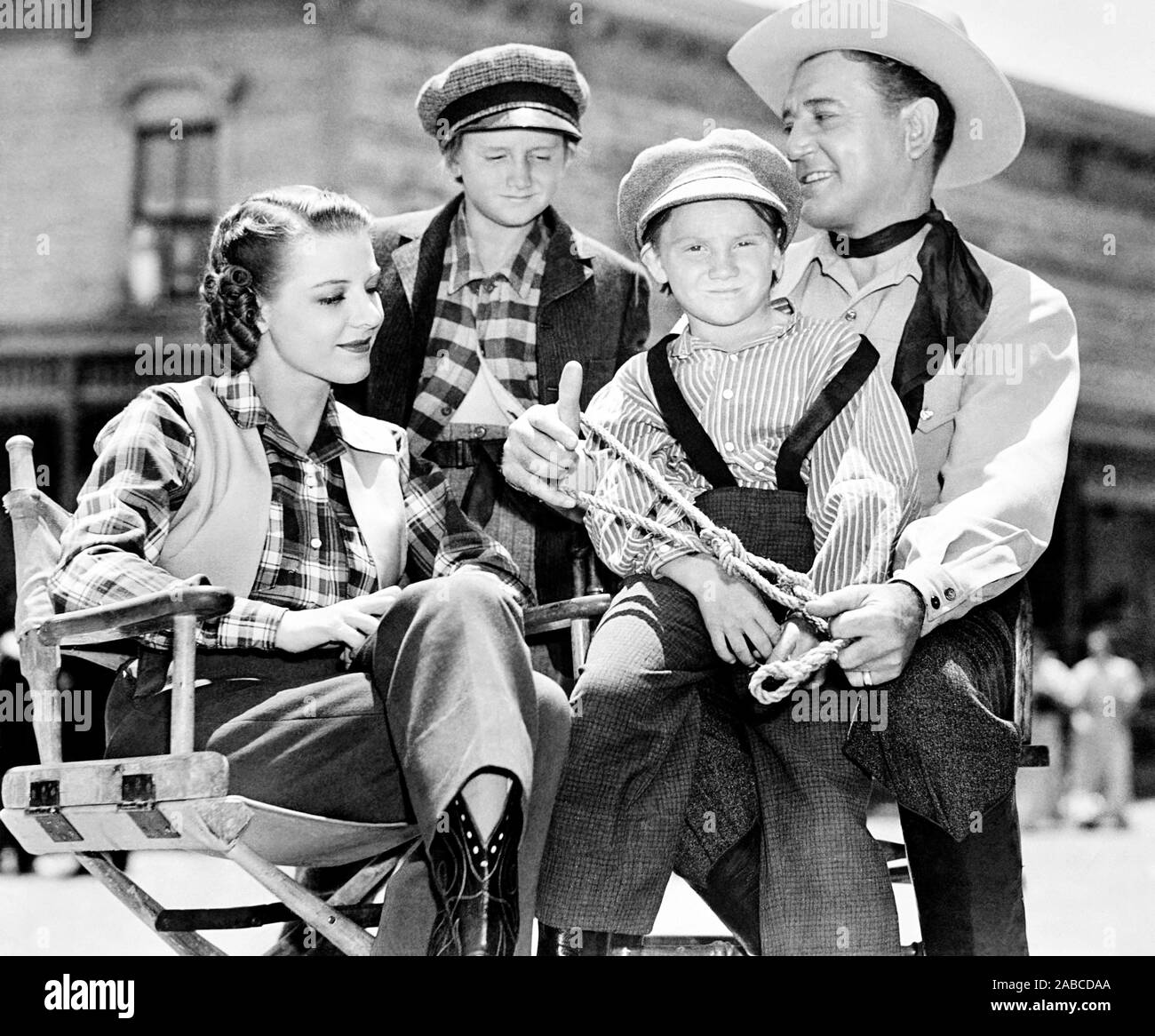 CHEROKEE STRIP, Florence Rice looks on as Richard Dix shows kids how to ...