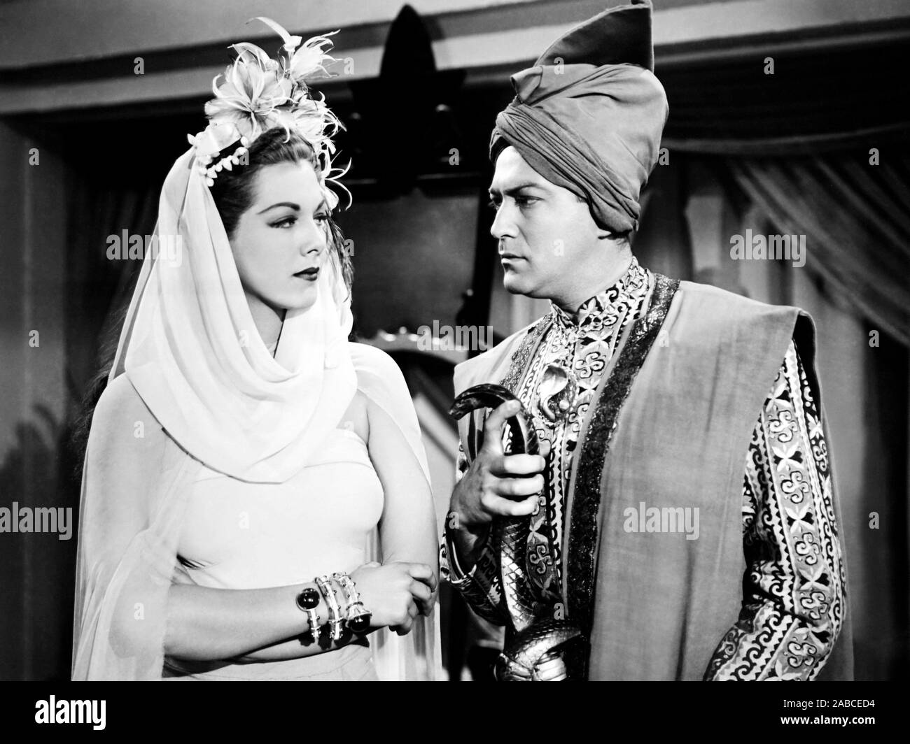 COBRA WOMAN, from left, Maria Montez, Edgar Barrier, 1944 Stock Photo ...