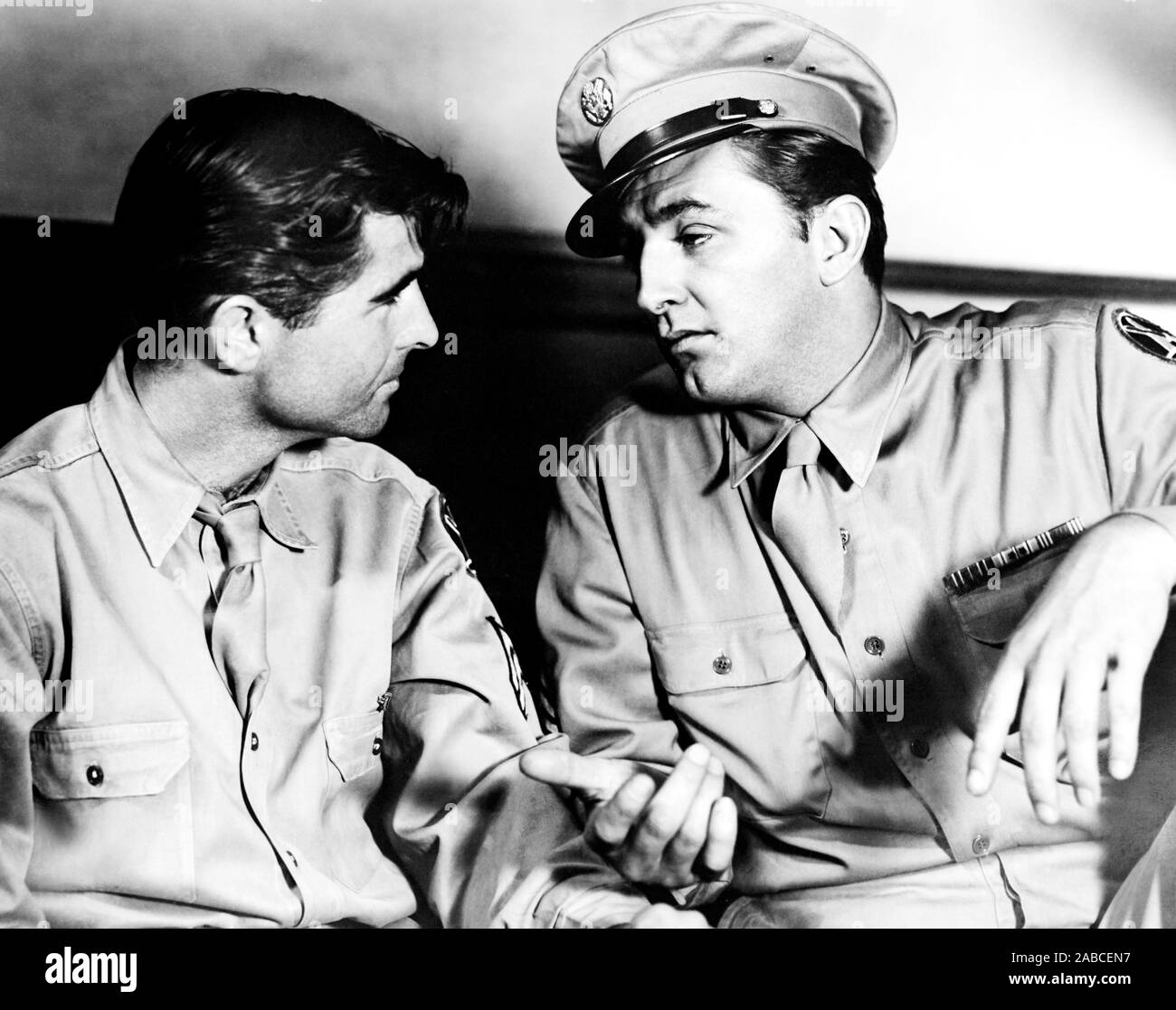 CROSSFIRE, from left, George Cooper, Robert Mitchum, 1947 Stock Photo ...