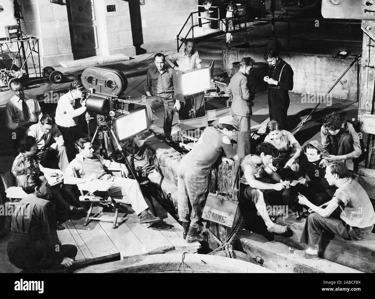 DEAD END, director William Wyler (seated in sweater) filming from left ...