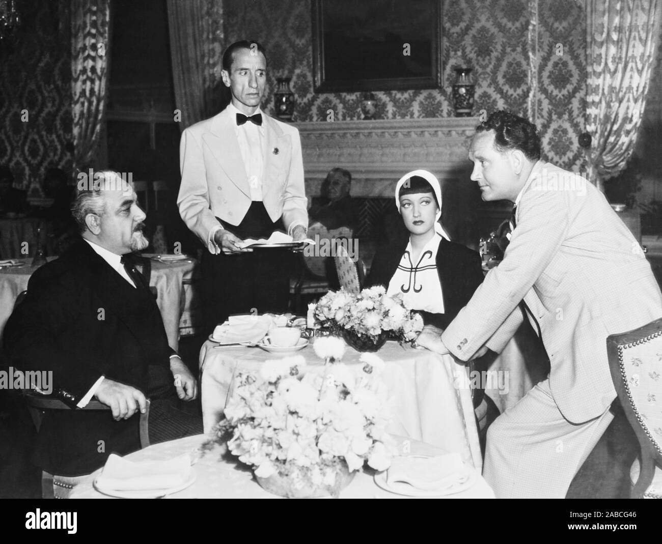 DISPUTED PASSAGE, seated from left: Akim Tamiroff, Dorothy Lamour ...