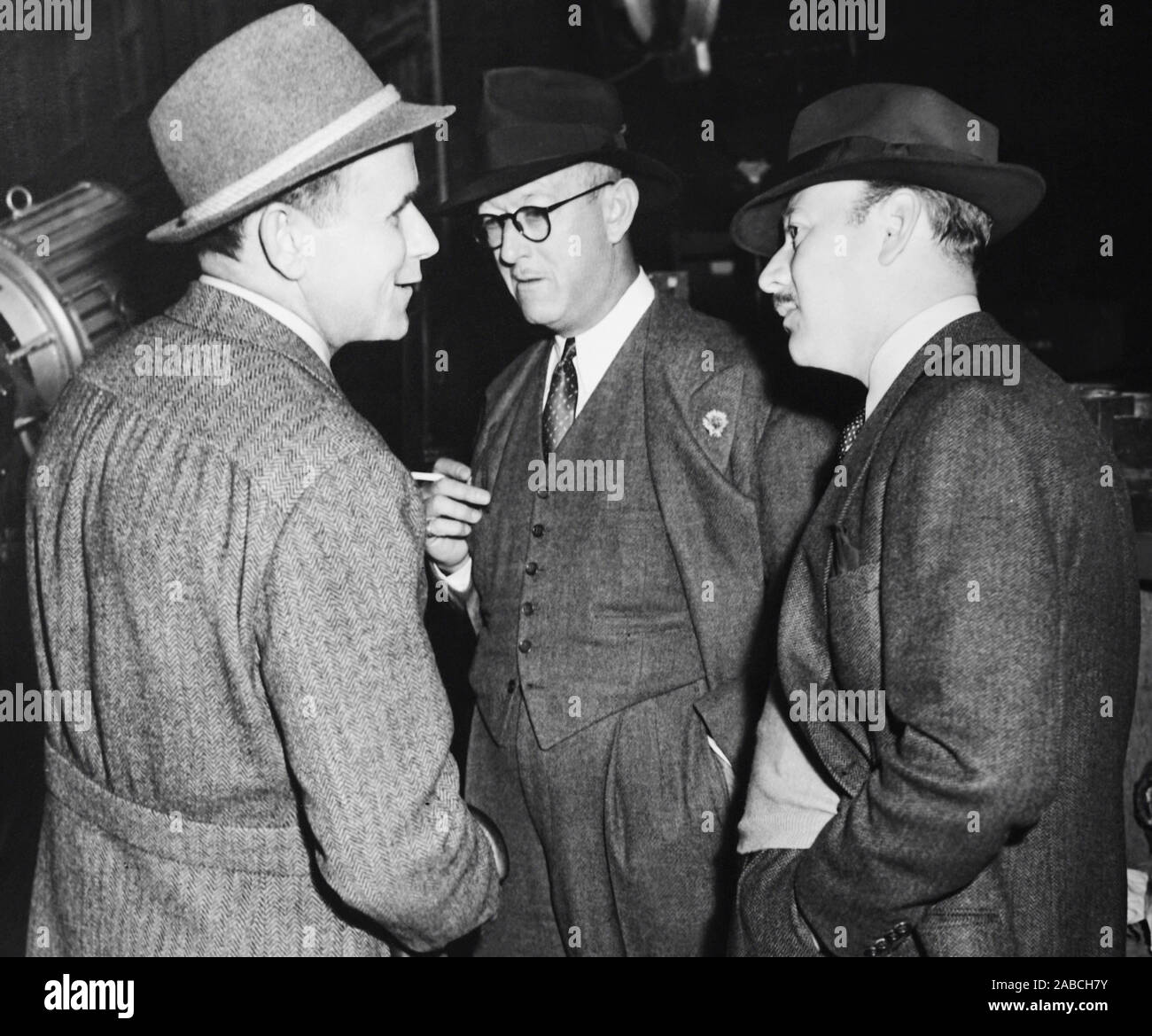 ETERNALLY YOURS, from left: director Tay Garnett, screenwriters Gene Towne, Graham Baker on set ...