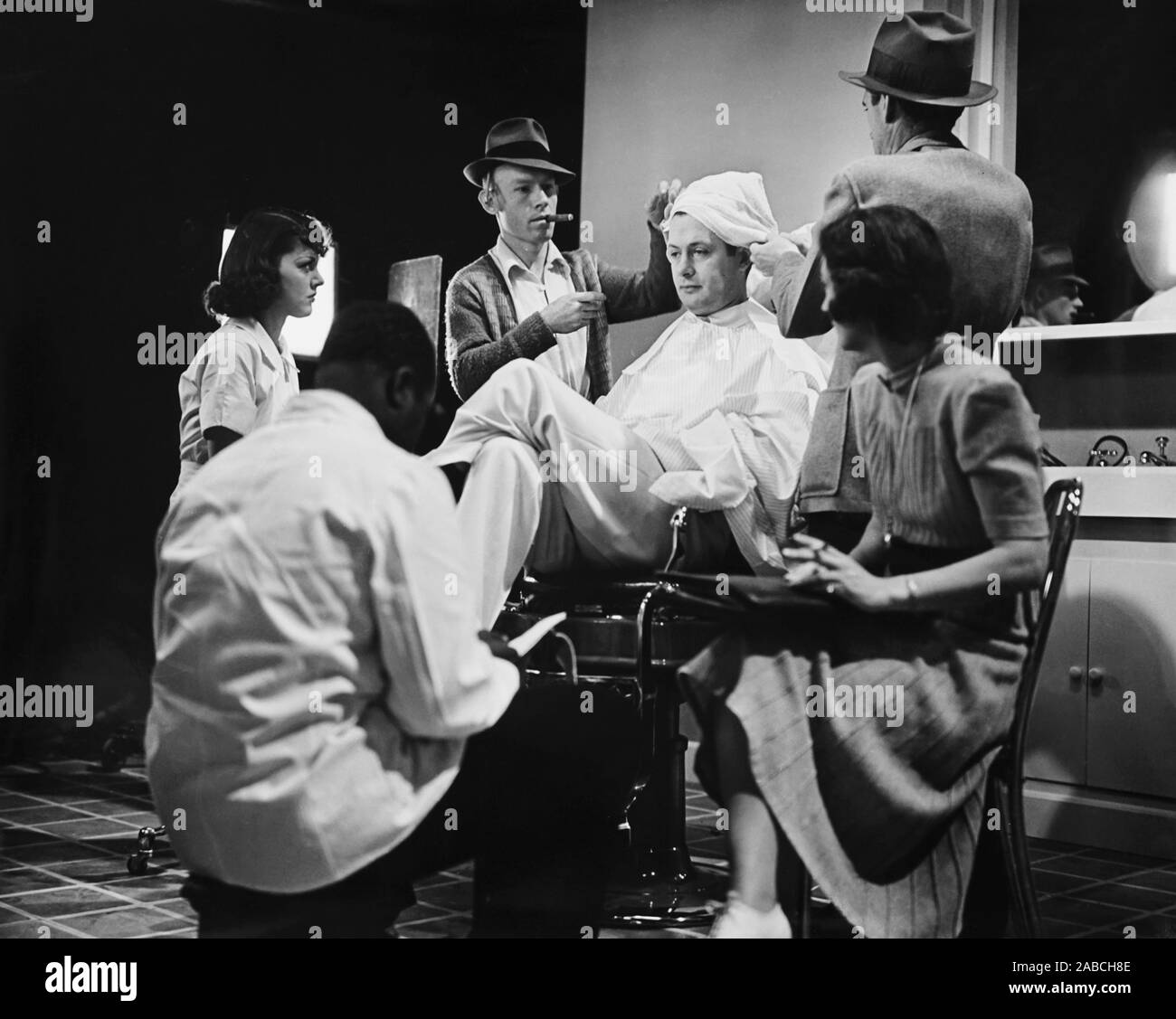 EVER SINCE EVE, robert Montgomery (seated center) preparing to film on ...
