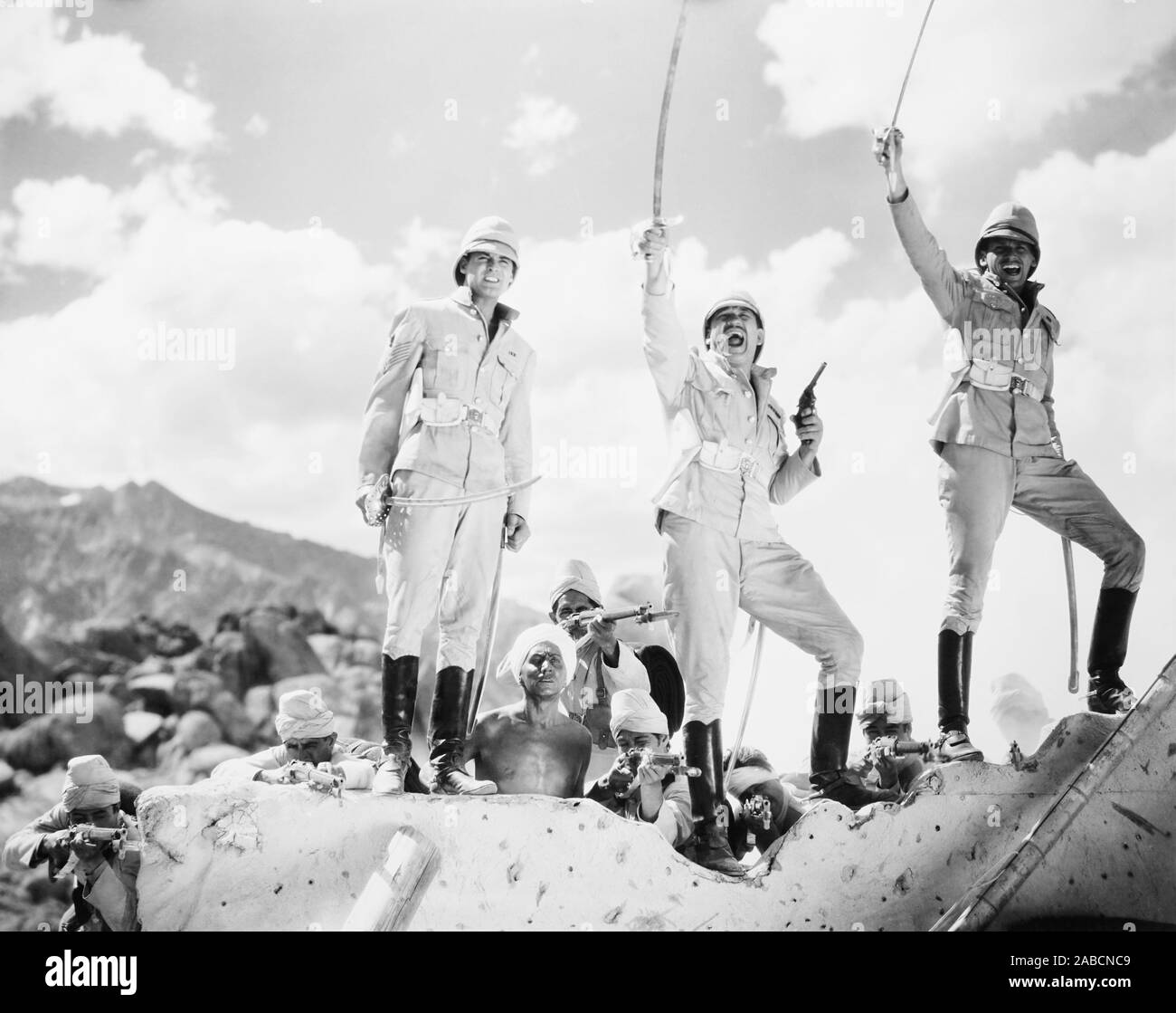 GUNGA DIN, from left: Cary Grant, Sam Jaffe (below wearing turban ...