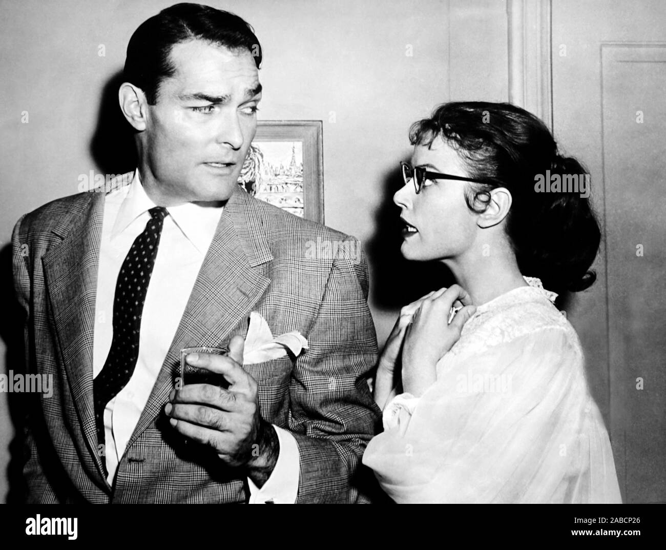 HELL BOUND, from left, John Russell, Margo Woode, 1957 Stock Photo - Alamy