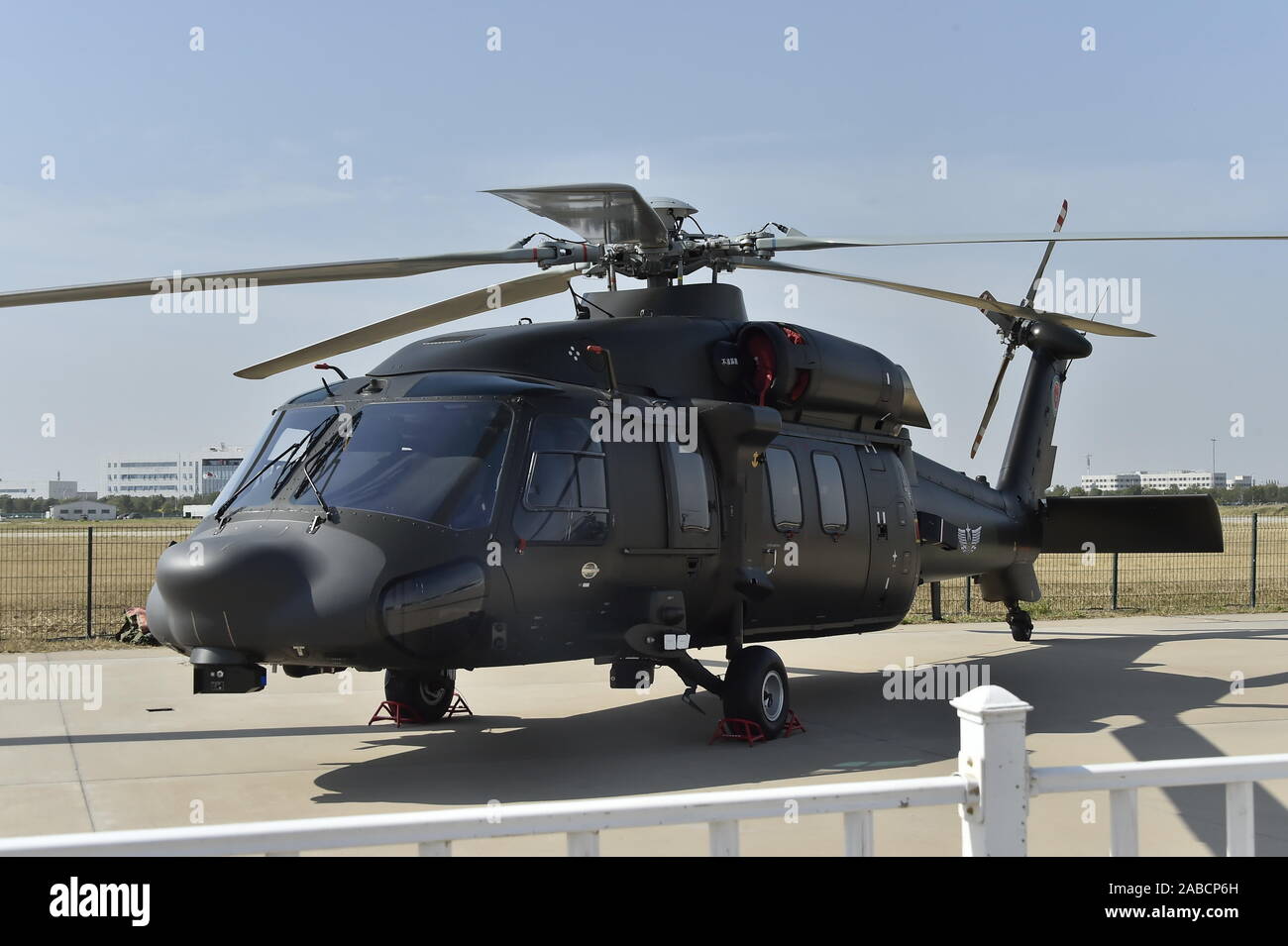 Picture of a Z-20 medium-lift utility helicopter arriving at the apron ...