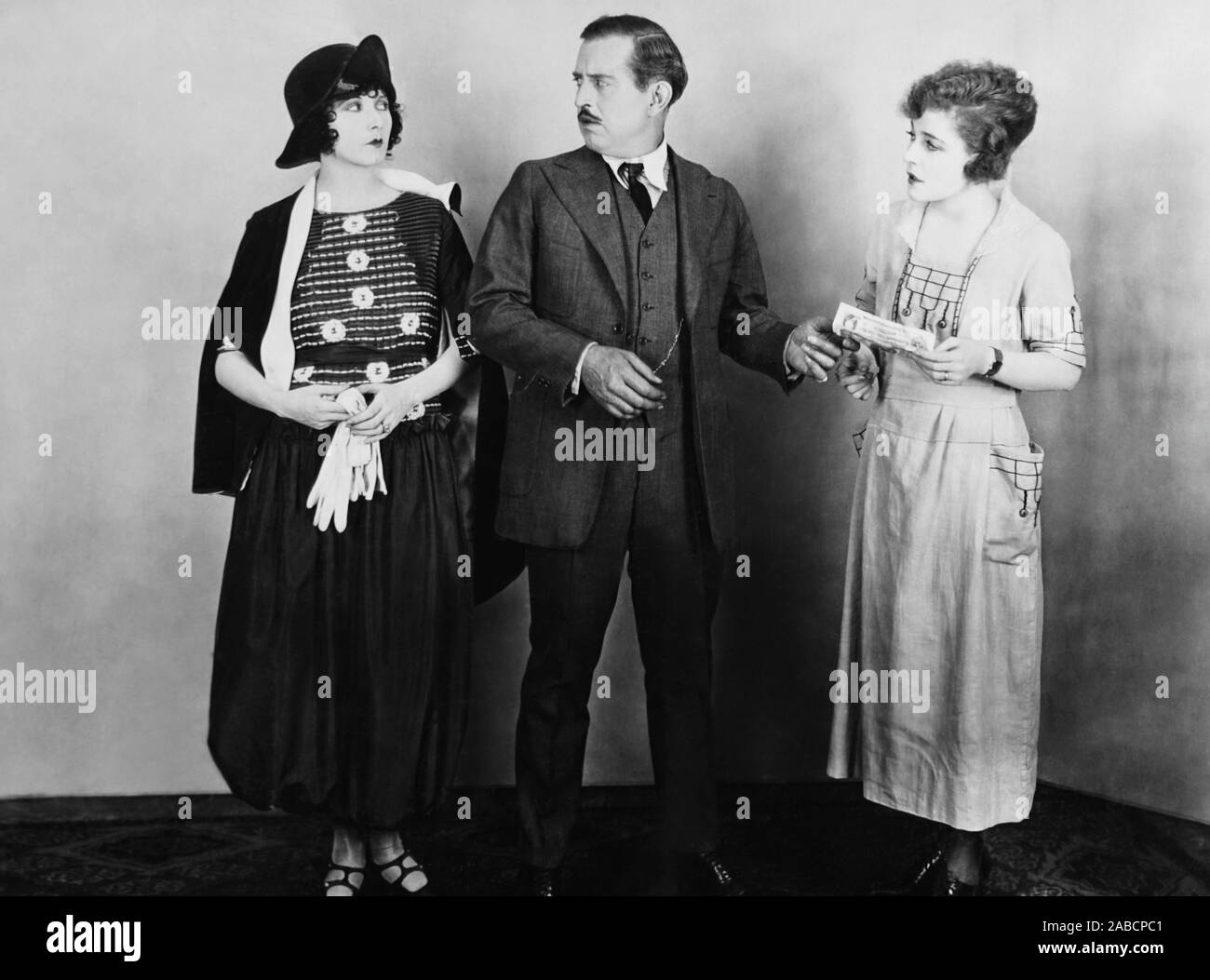 HER OWN MONEY, from left: Mae Busch, Clarence Burton, Ethel Clayton ...