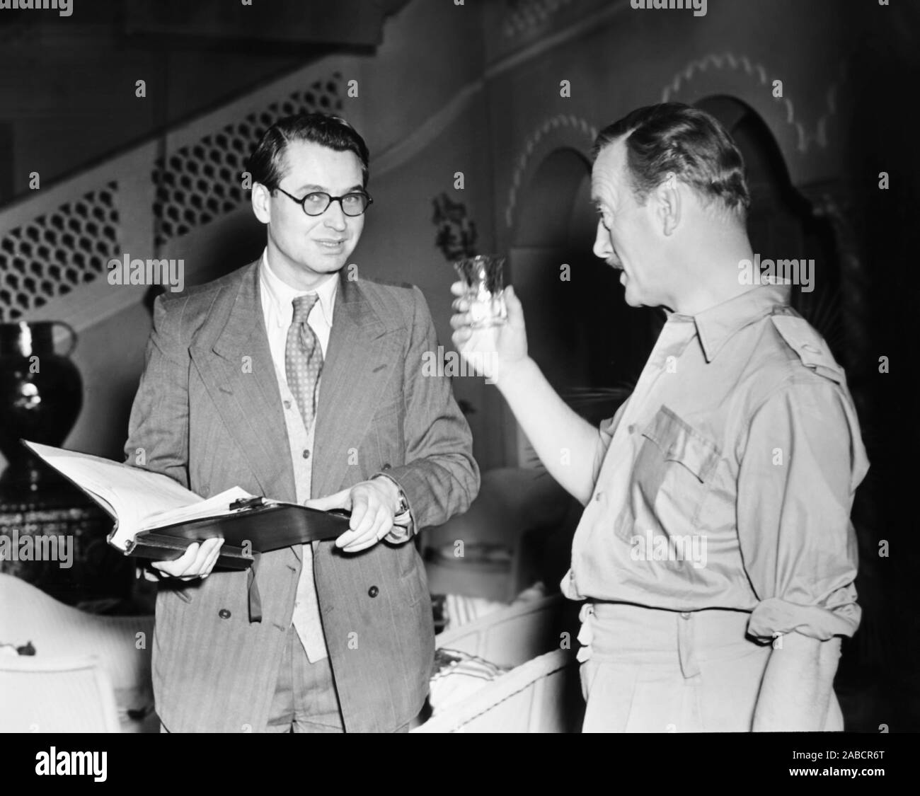 HOTEL SAHARA, from left: director Ken Annakin, roland Culver on set ...
