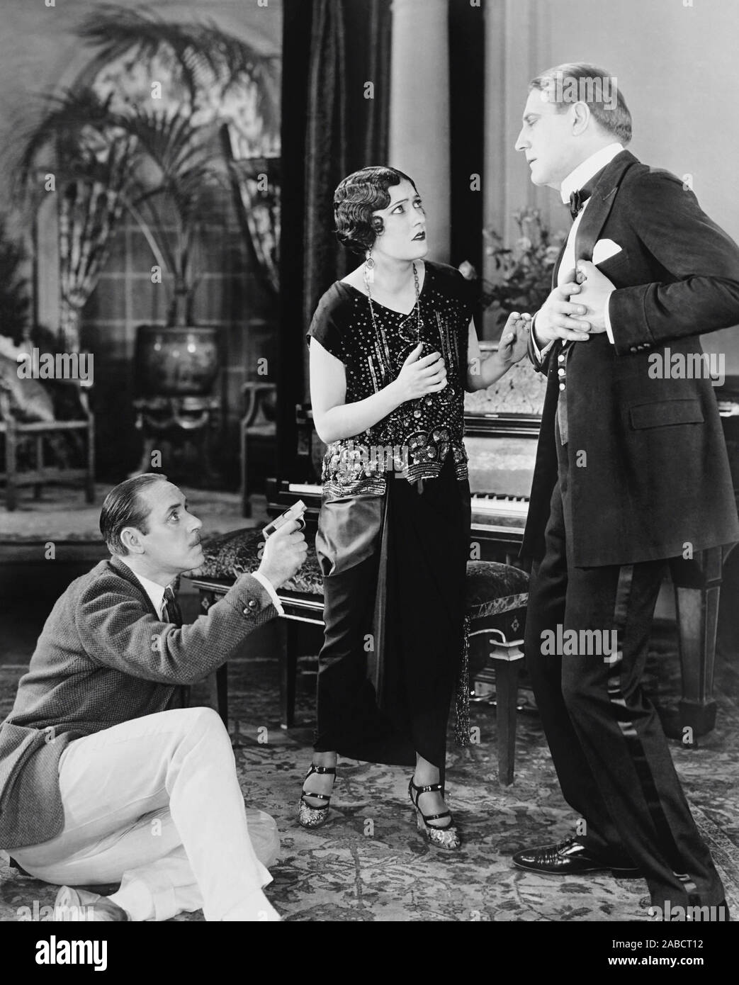 THE IMPOSSIBLE MRS. BELLEW, from left: Clarence Burton, Gloria Swanson ...