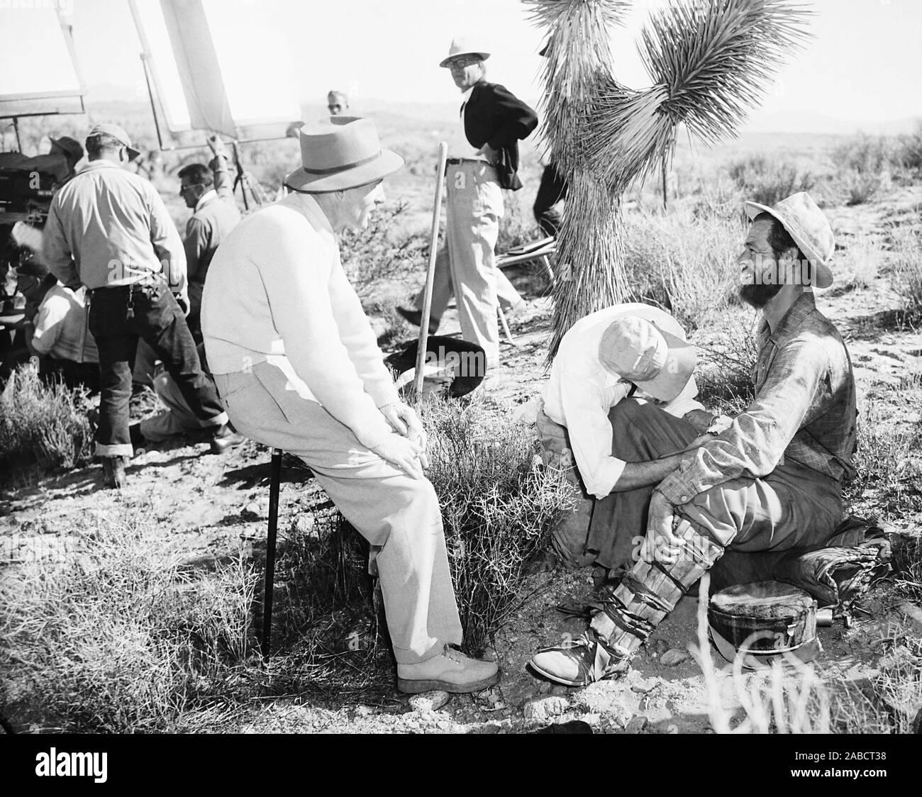 INFERNO, seated from left: director Roy Ward Baker, Robert Ryan on set ...