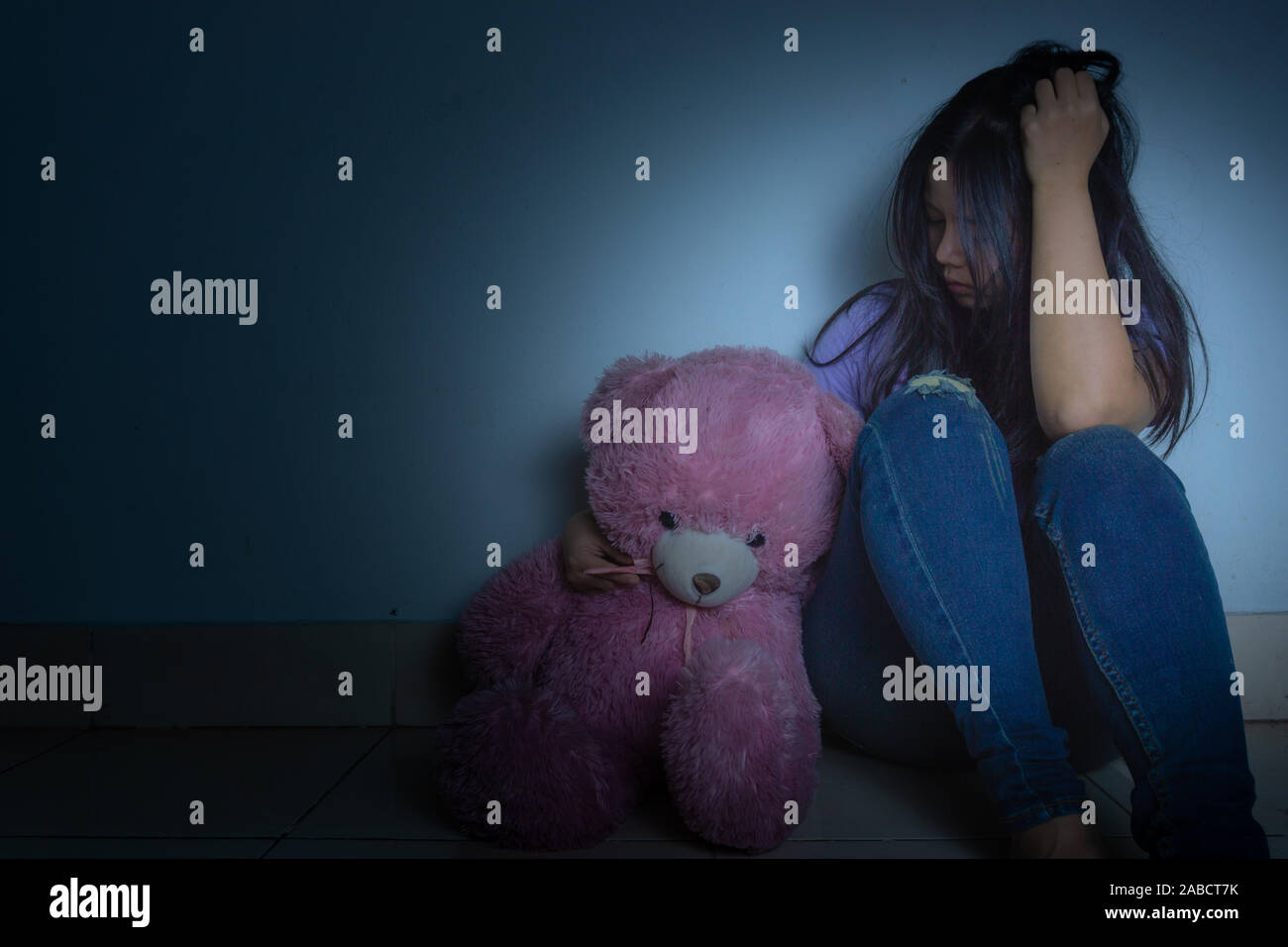 Sad woman hug her knee and cry hi-res stock photography and images - Alamy