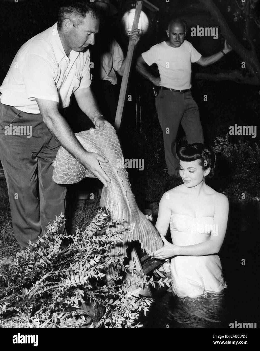 KATIE DID IT, from left: prop man Blackie Rosenkrantz jokingly hands ...