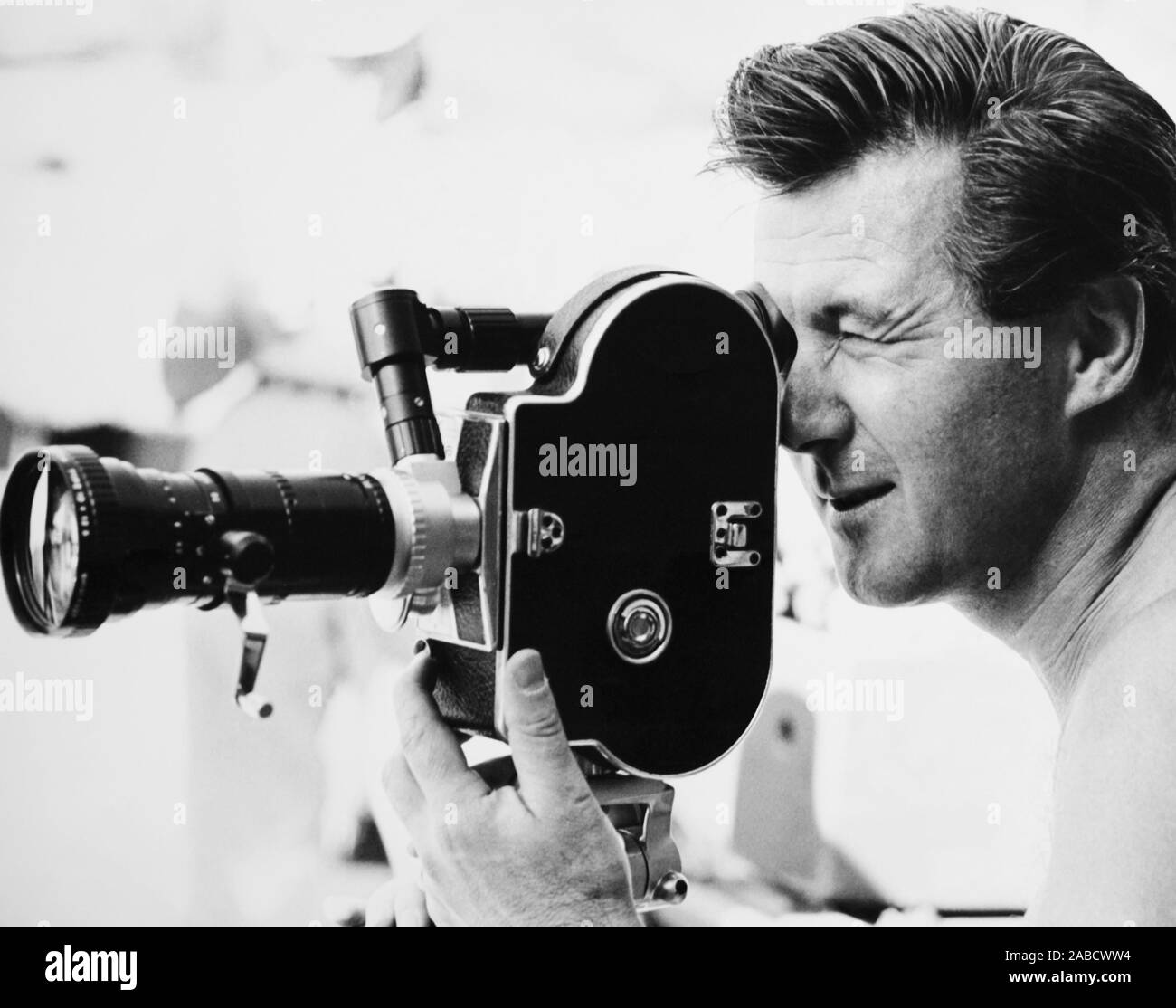 KING RAT, director Bryan Forbes making his own 16mm film of the filming ...