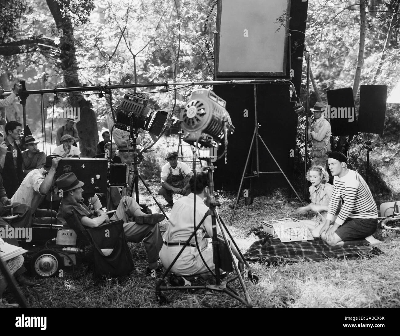 THE LADY ESCAPES, director Eugene Fode (seated left) filming Gloria ...