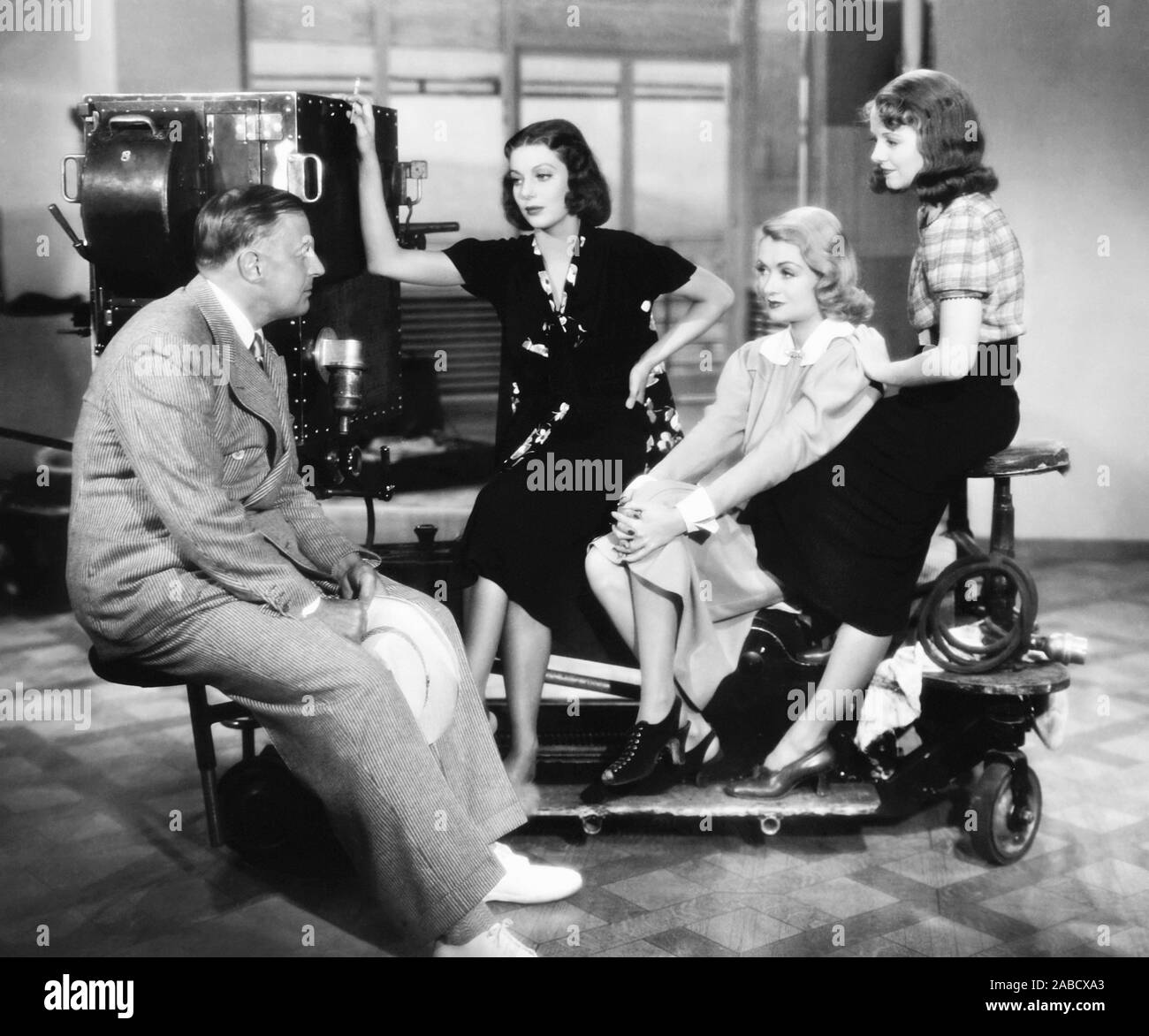 LADIES IN LOVE, from left: director Edward H. Griffith, Loretta Young ...