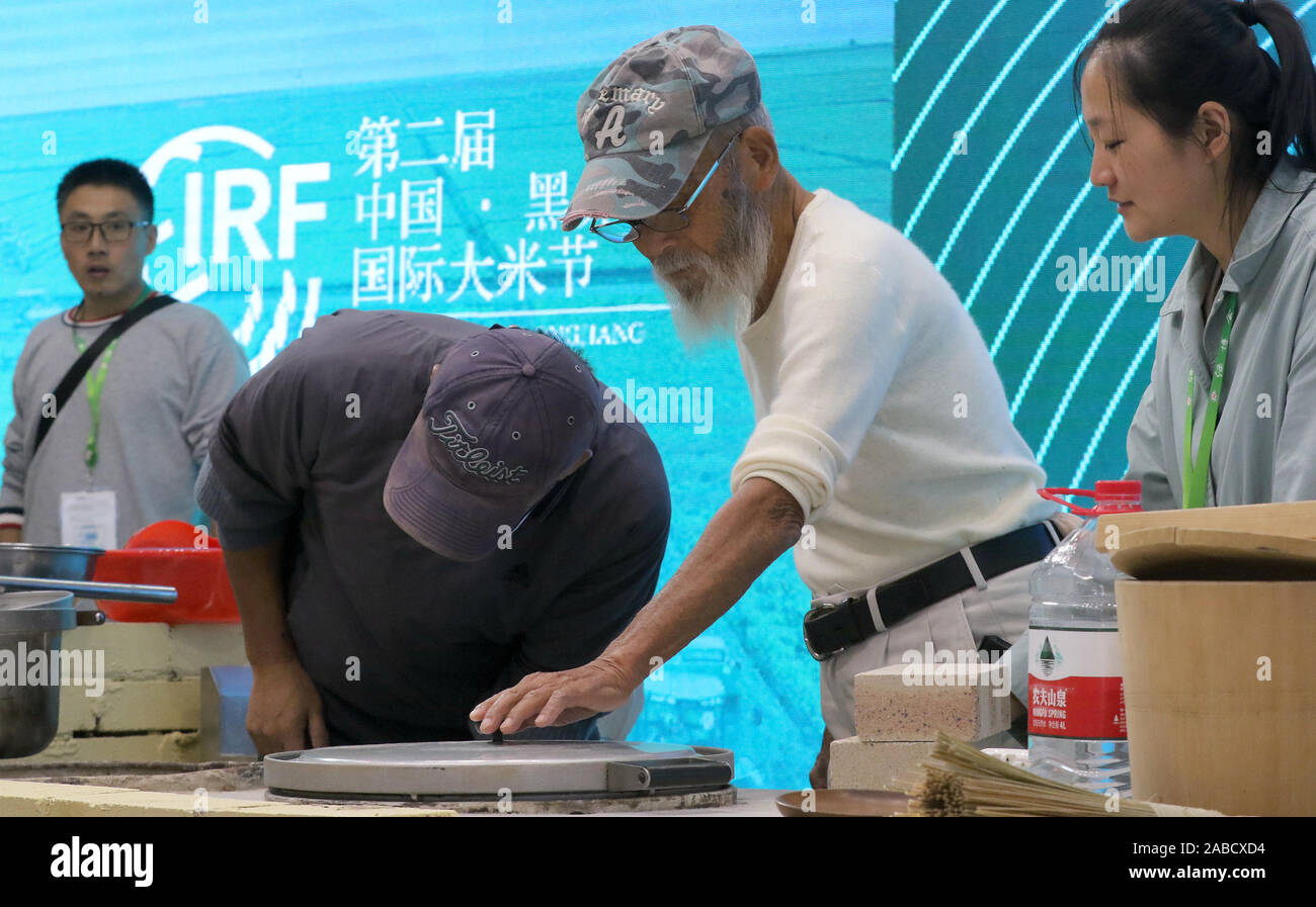 Japanese 'Rice Fairy' Murashima Mou, middle, makes rice at the 2nd ...