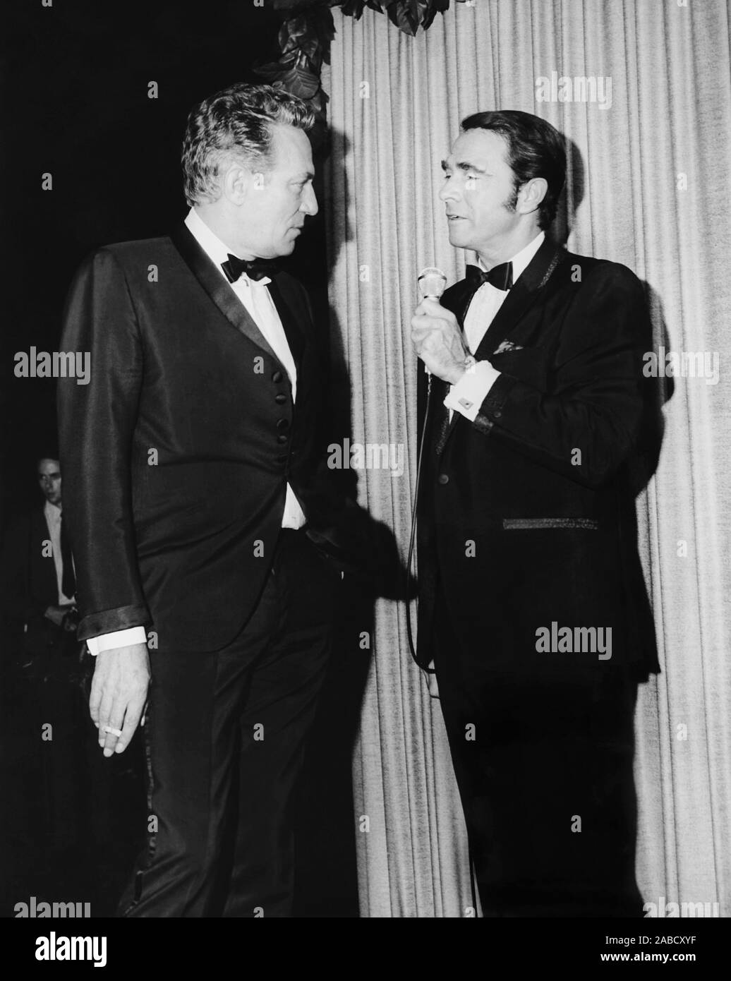 THE LEGEND OF LYLAH CLAIRE, from left: Peter Finch being interviewed by ...