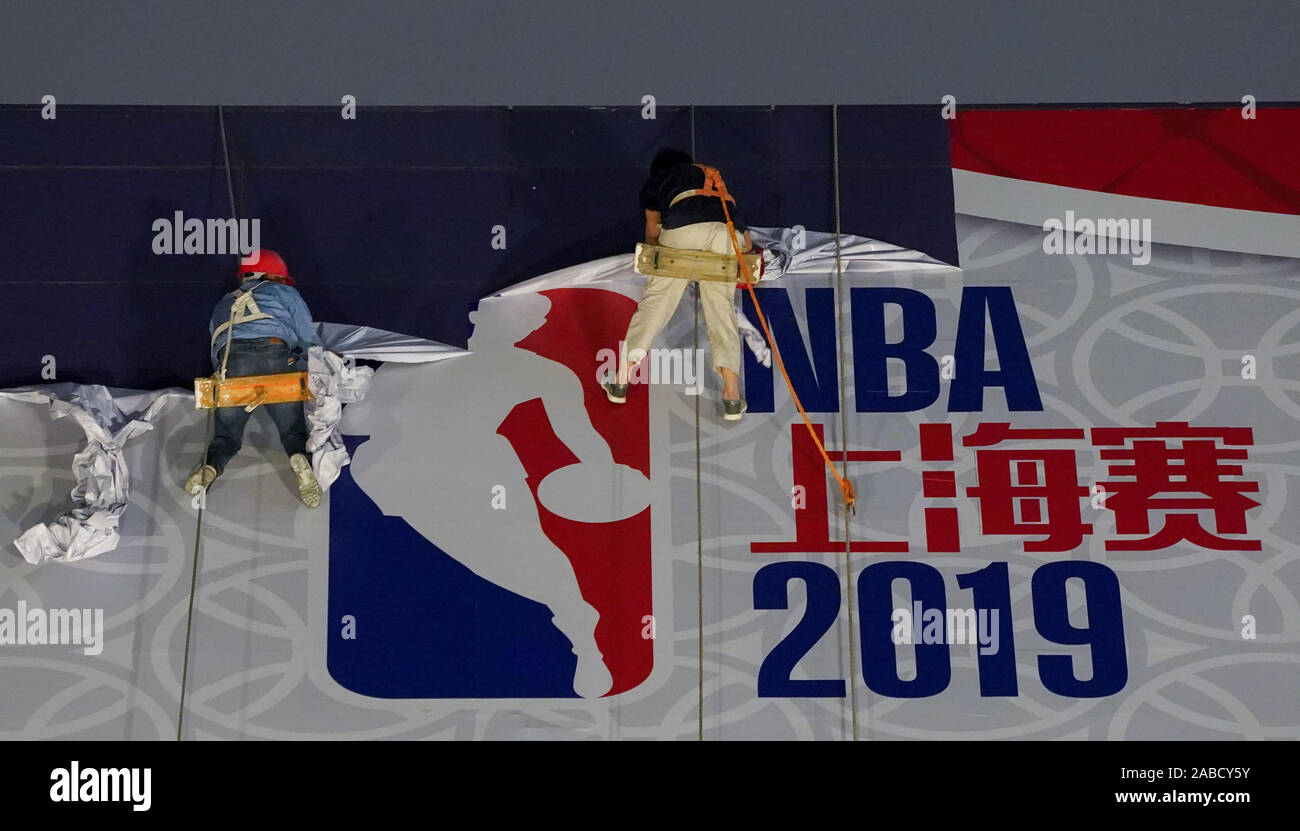Construction workers dismentle a giant poster of NBA before 2019 NBA ...