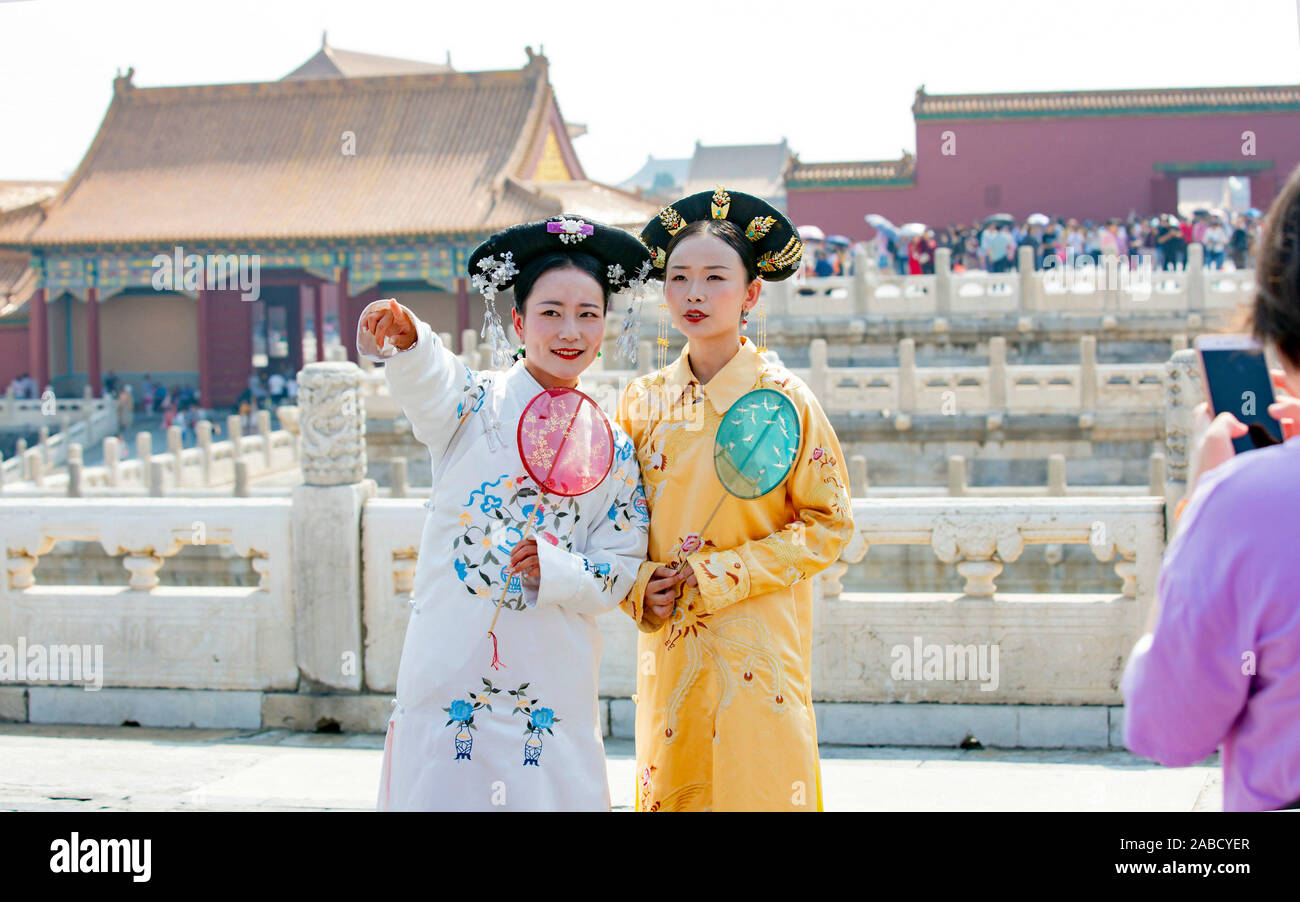 Two female tourists dressed as Gege, an imperial-born princess of an ...
