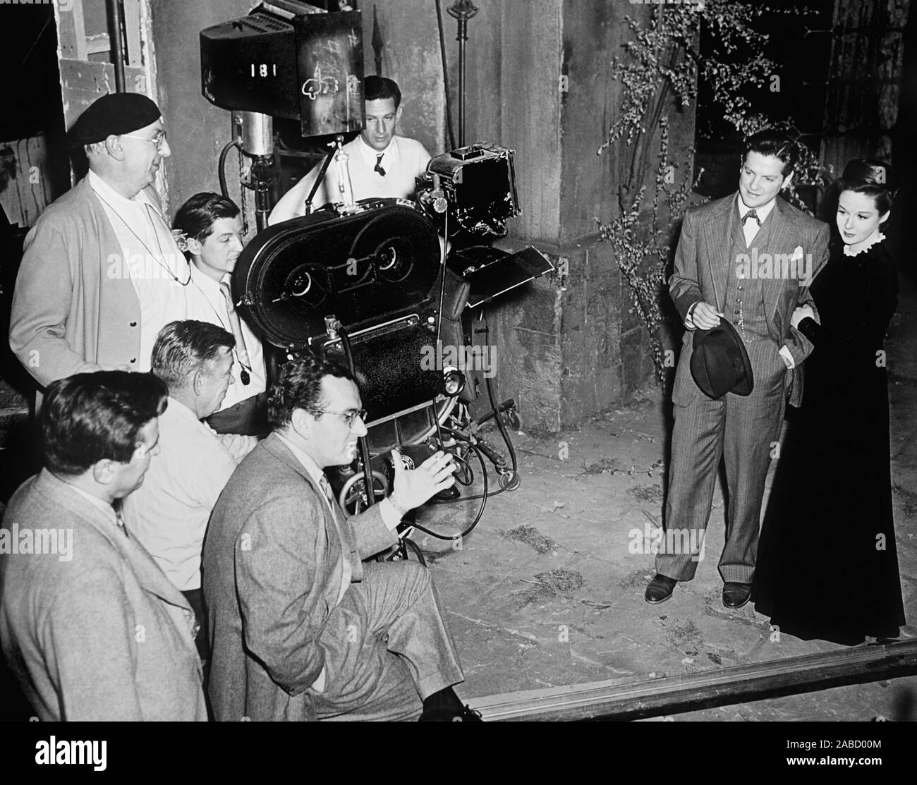 THE LOST MOMENT, from left: cinematographer Hal Mohr (beret), director ...