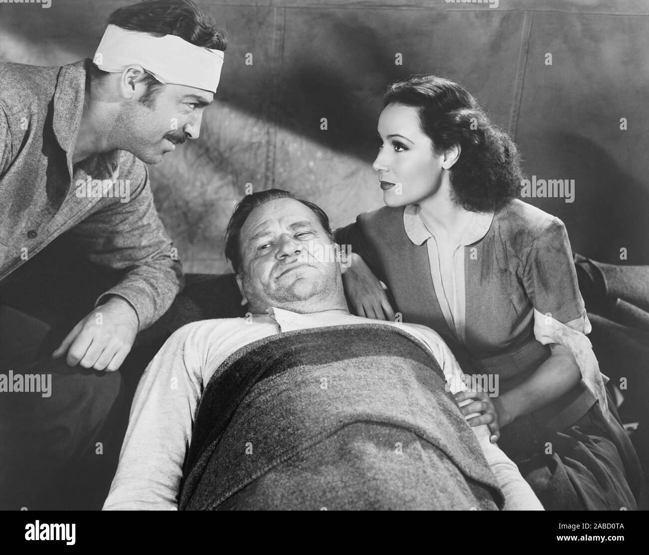 THE MAN FROM DAKOTA, from left: John Howard, Wallace, Beery, Dolores ...